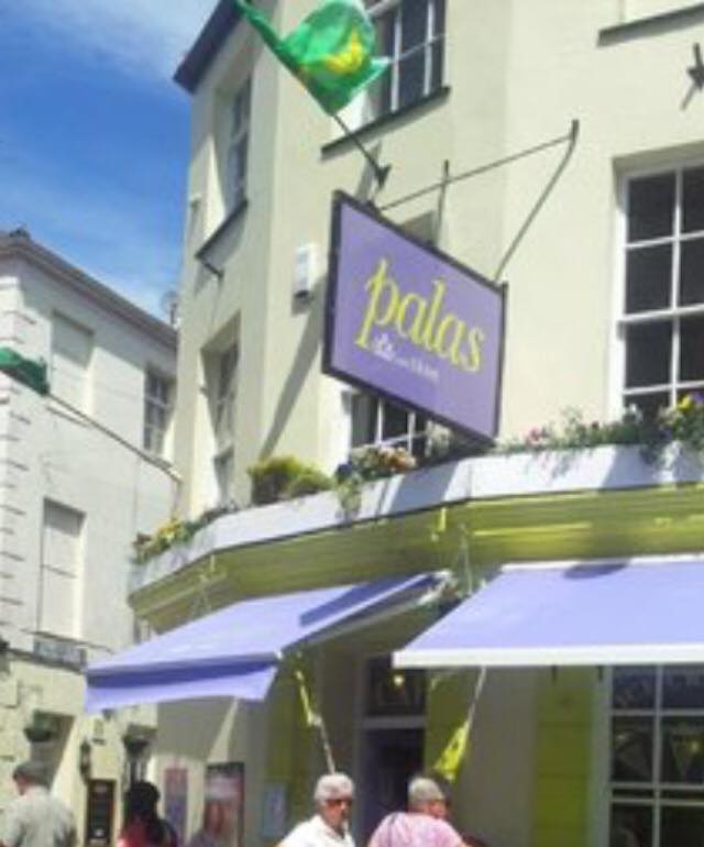 The Caernarfonshire flag flying at the Palas Cafe, Caernarfon | British ...